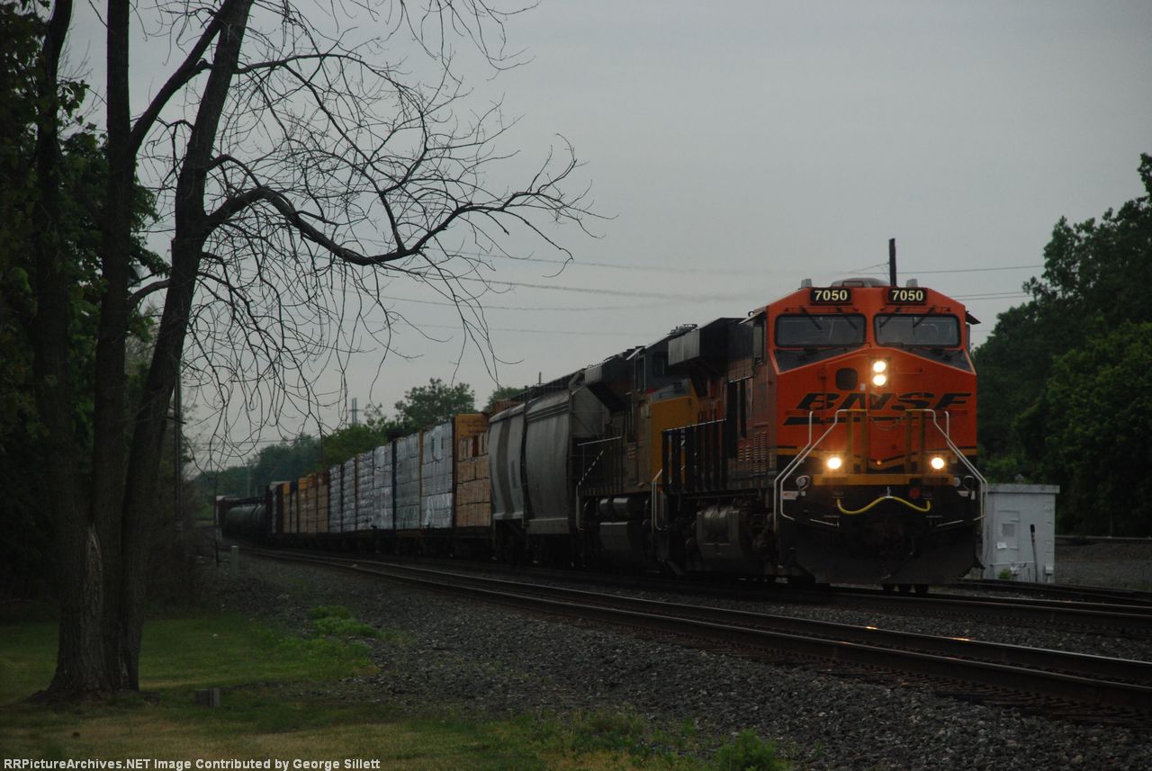 BNSF 7050 takes charge of an eastbound mixer.